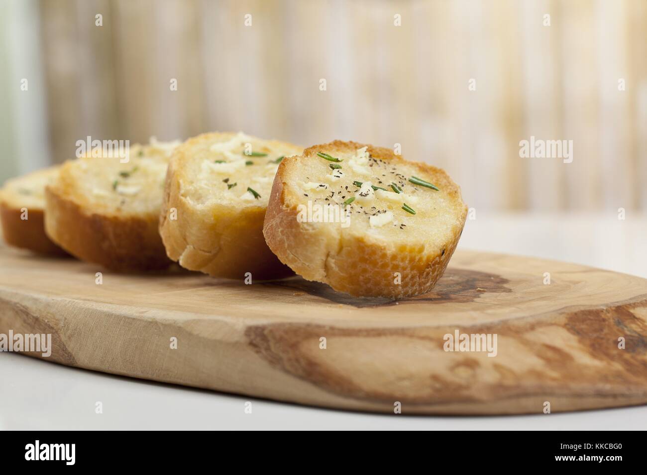 toasted baguette bread slices with garlic and pepper Stock Photo - Alamy