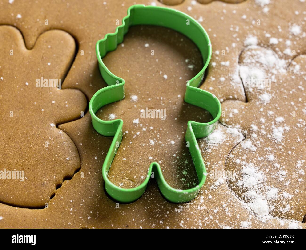 view of green cookie cutter on cookie dough Stock Photo - Alamy