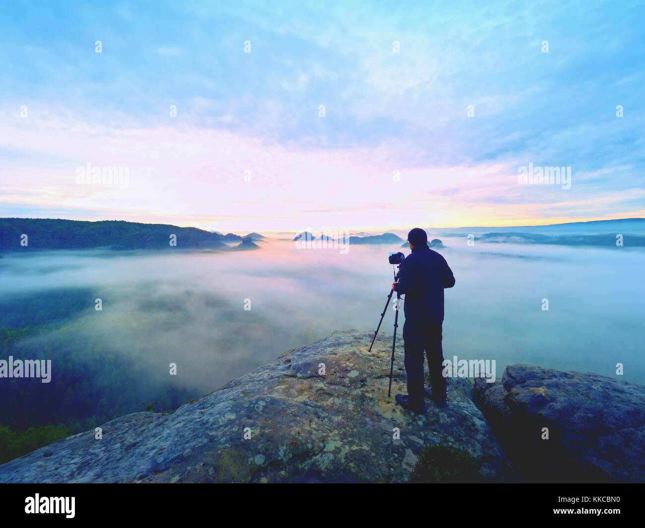 Photographer framing picture with eye on viewfinder. Photo enthusiast ...