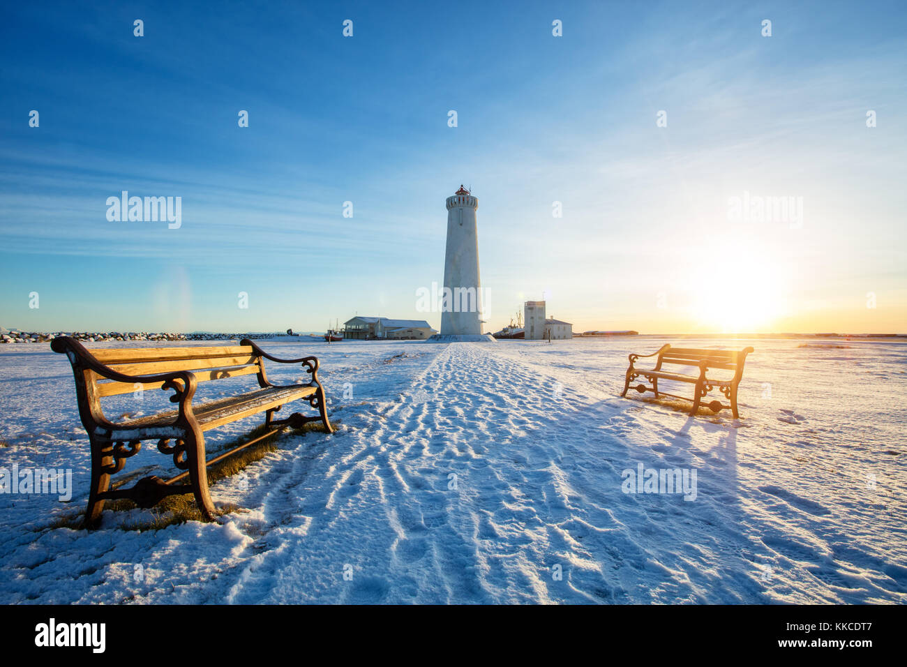 Beautiful Gardur lighthouse in Iceland with two benches. Winter ...
