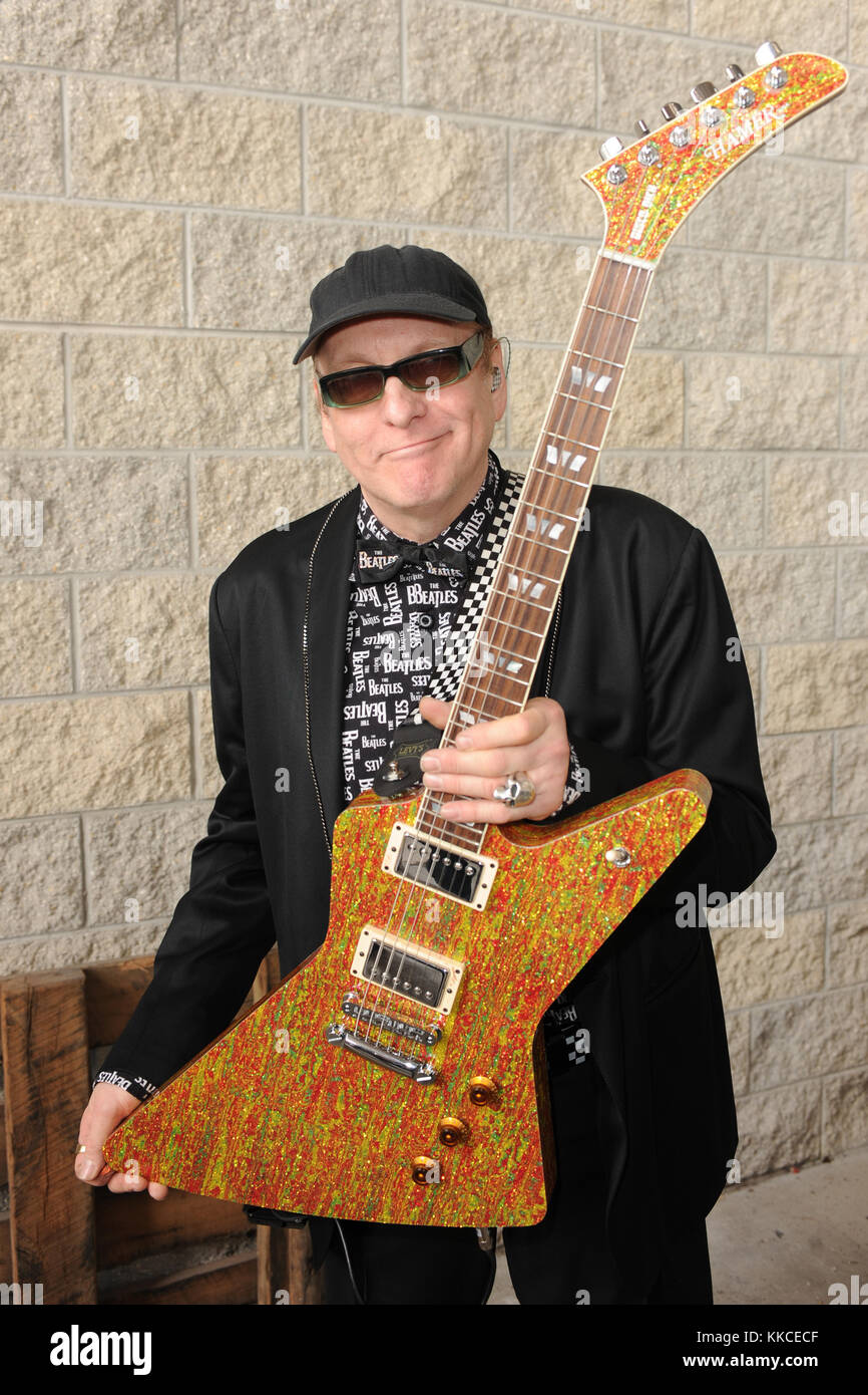 MIAMI, FL - DECEMBER 27: Rick Nielsen of Cheap Trick poses backstage at ...