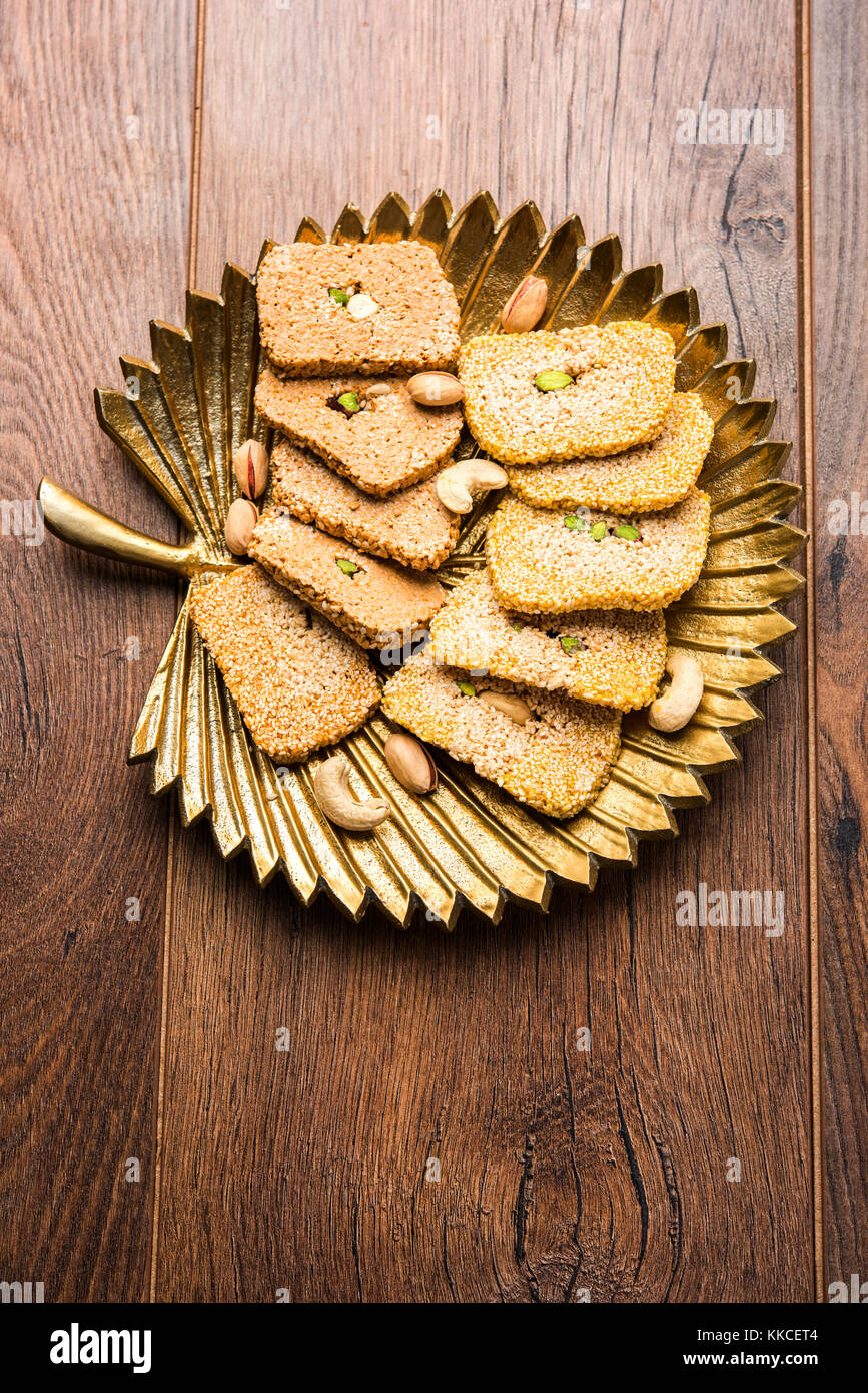 Gajak or til papdi or patti is a dry sweet cake - made of sesame seeds ...