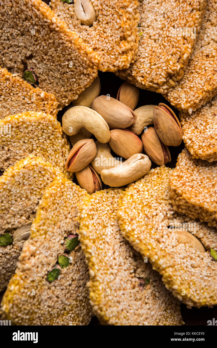 Gajak or til papdi or patti is a dry sweet cake - made of sesame seeds ...