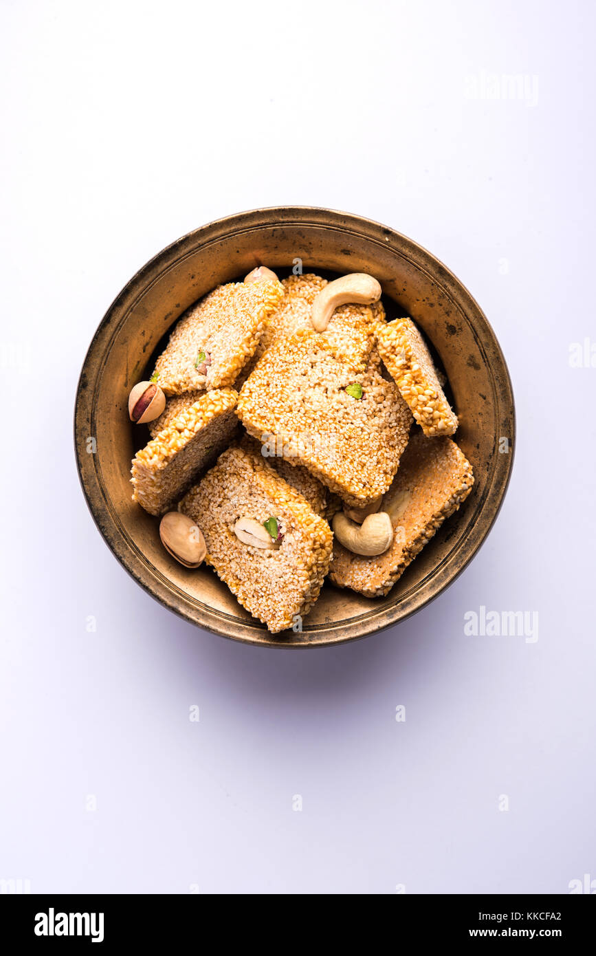 Gajak or til papdi or patti is a dry sweet cake - made of sesame seeds ...
