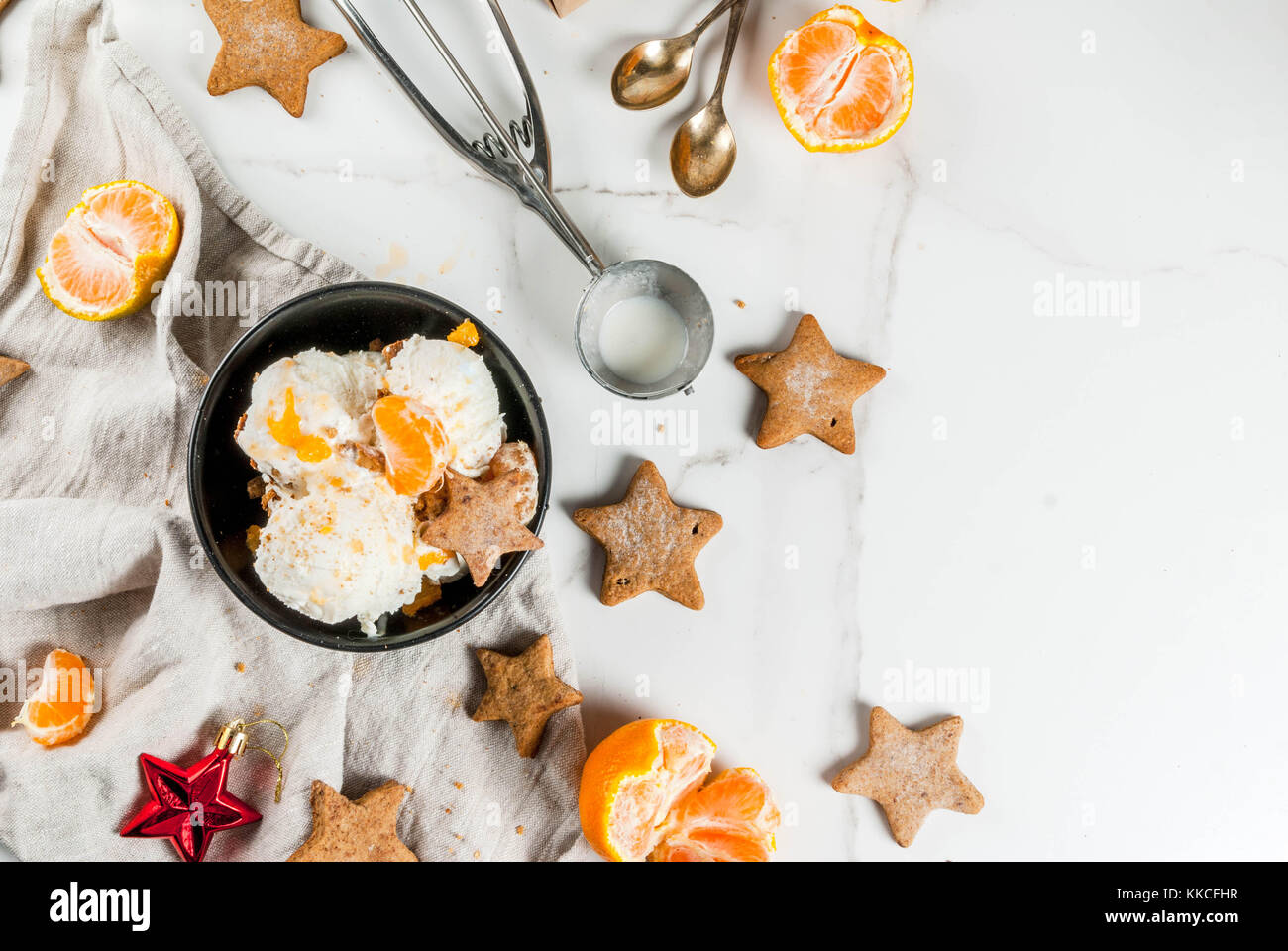 Winter Ice cream with gingerbread and tangerines, on white marble ...