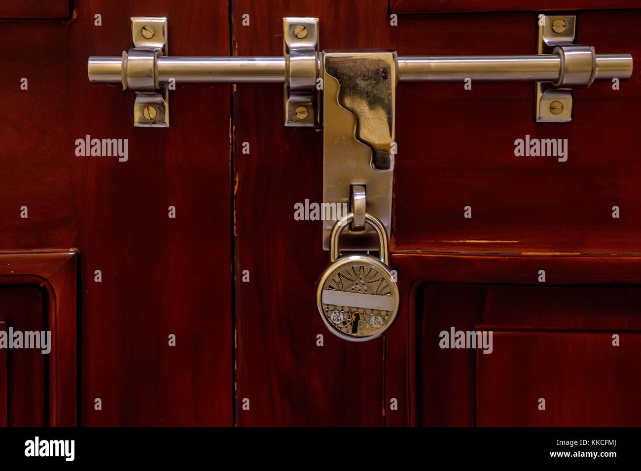 Door latch on wooden surface and lock Stock Photo - Alamy