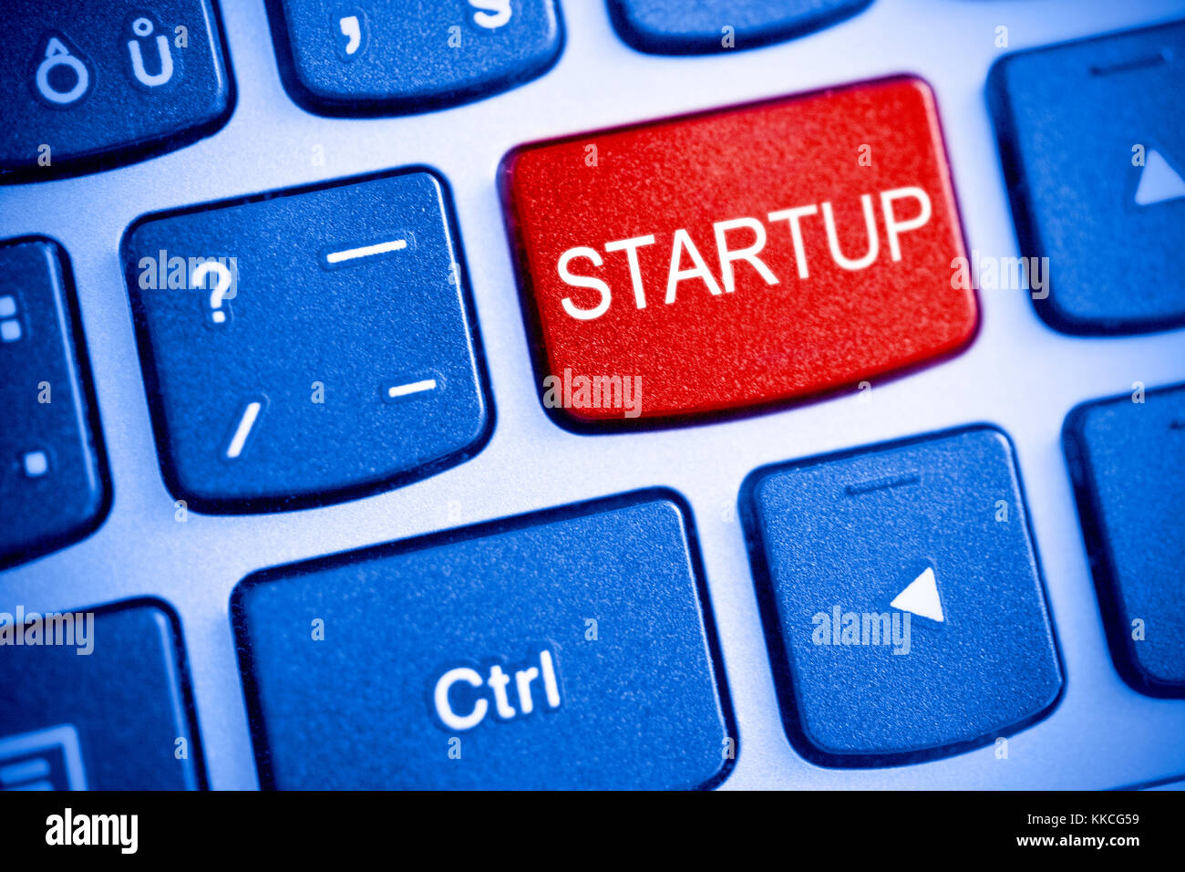red Start-up button on the blue keyboard - business concept Stock Photo ...