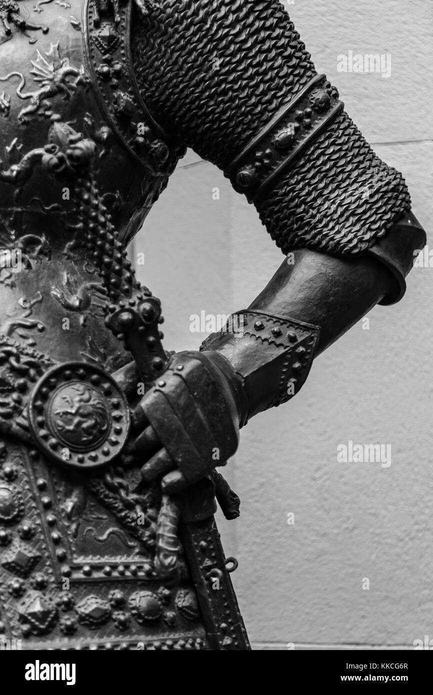 Hand in armour of the medieval knight statue Stock Photo - Alamy