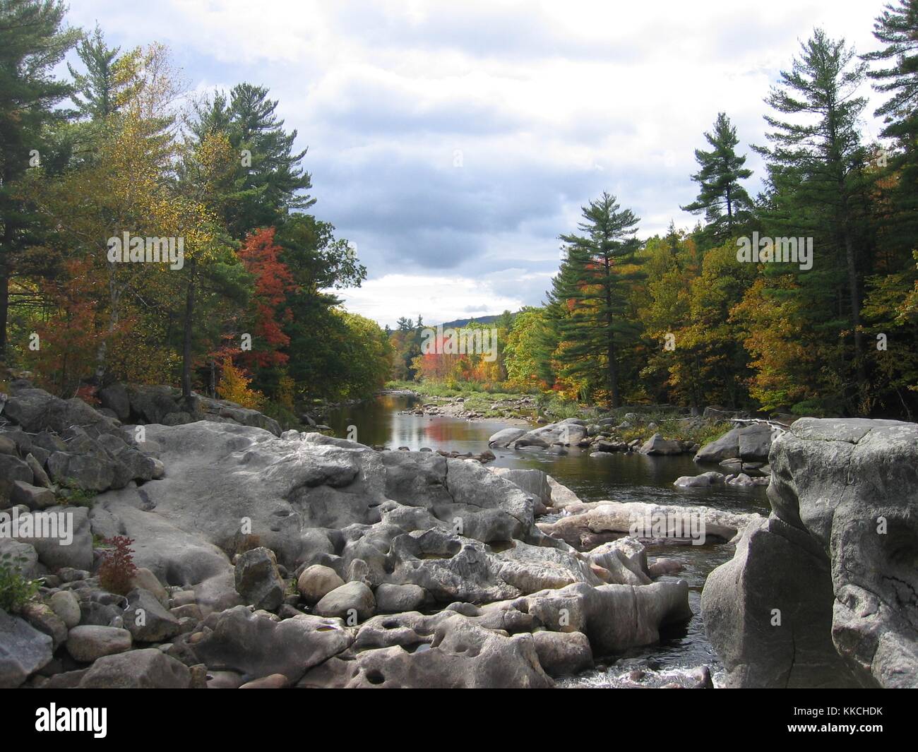 A landscape photograph of the Swift River featuring rocks that contain ...