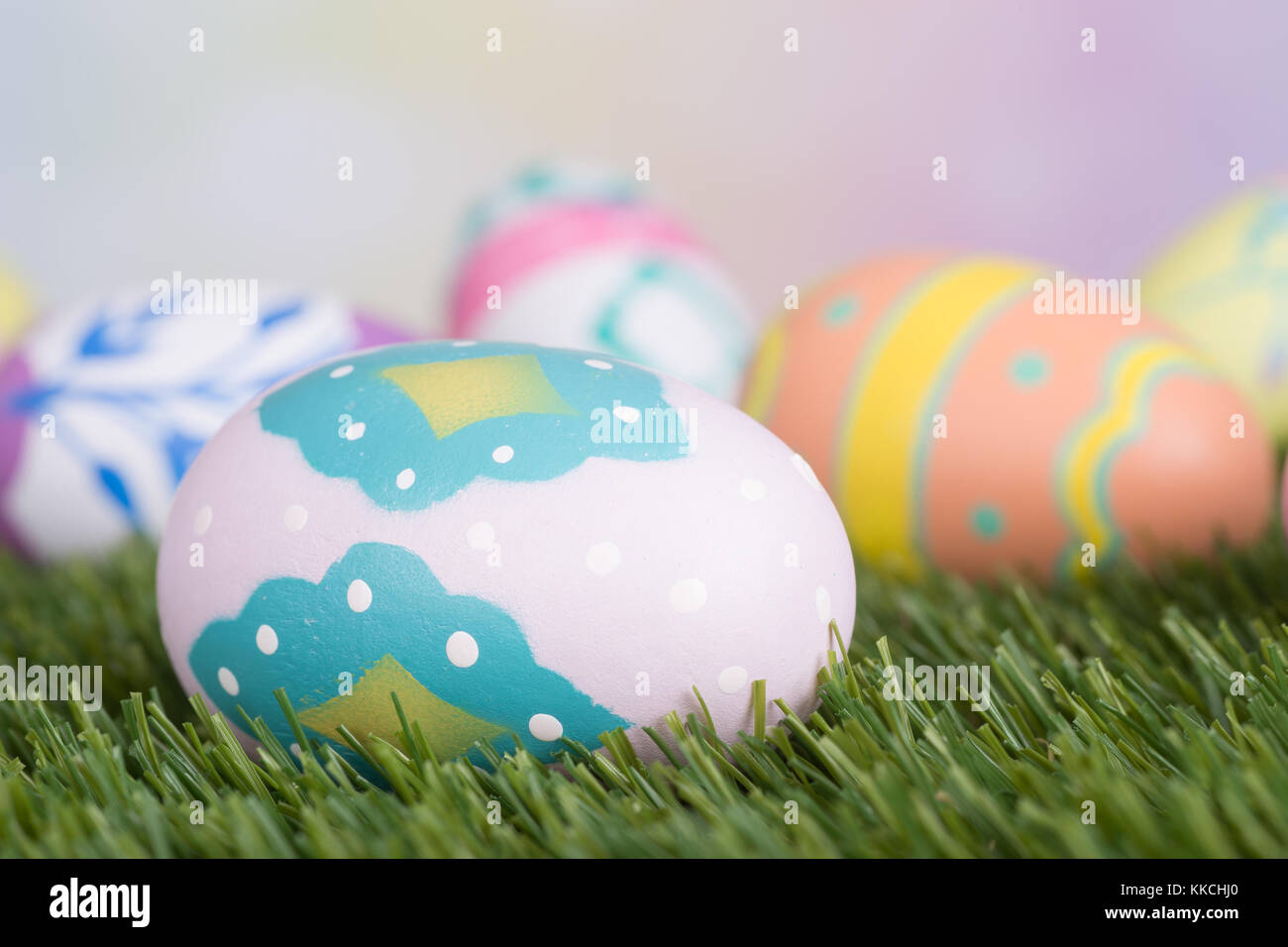Closeup of colorful easter egg on grass Stock Photo - Alamy