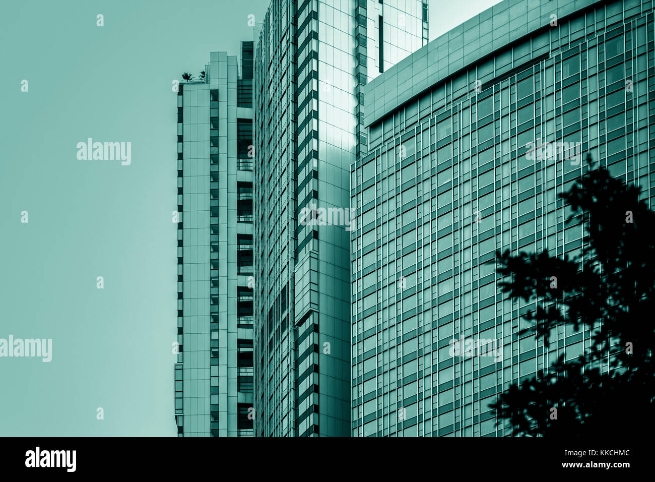 Modern office building detail in green color Stock Photo - Alamy