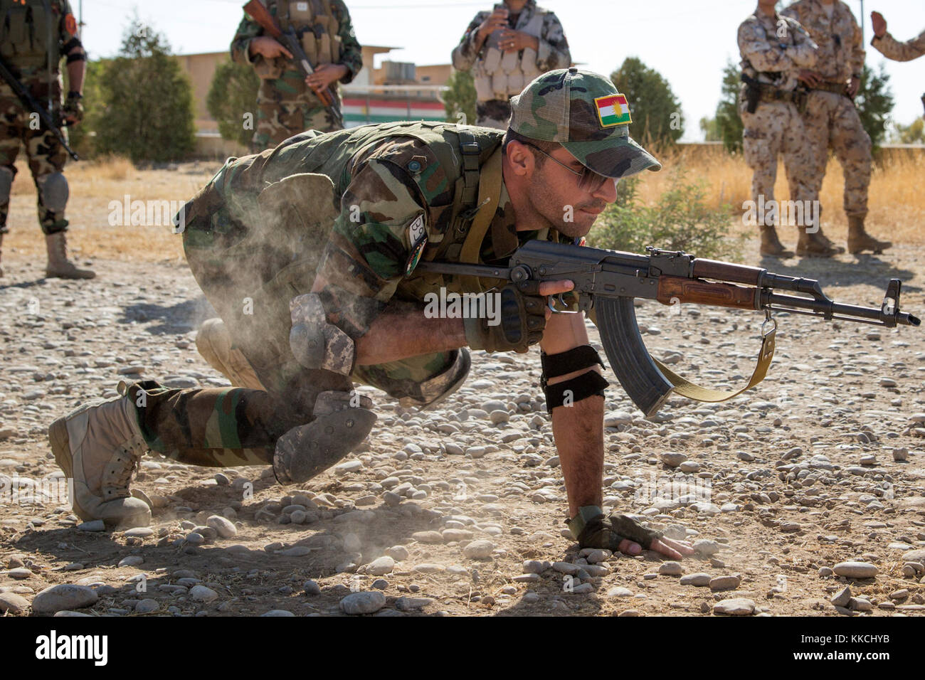 A Peshmerga soldier gets into firing position during advanced ...