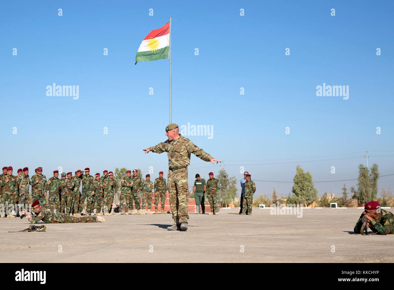 A British army trainer gives instruction to Peshmerga soldiers during ...