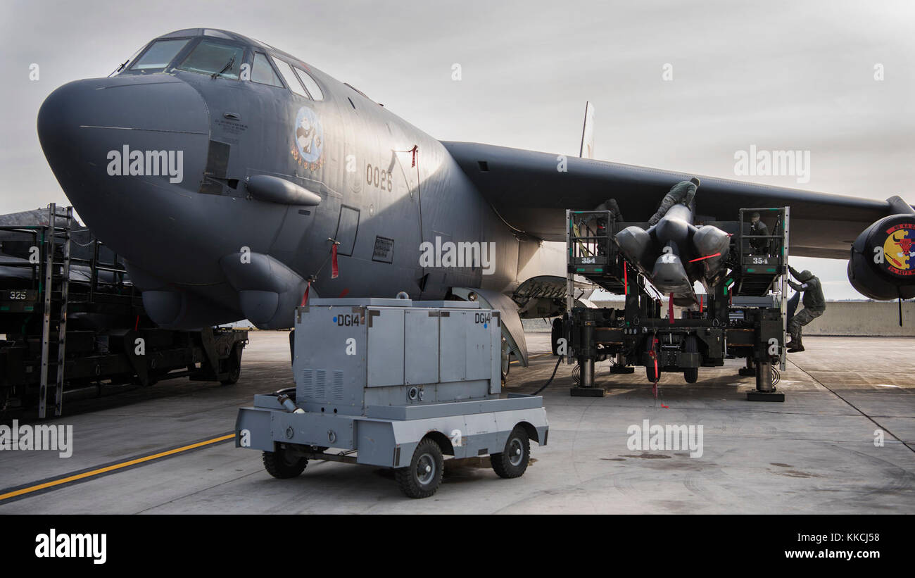 Team Minot Airmen load munitions on to a B-52H Stratofortress assigned ...