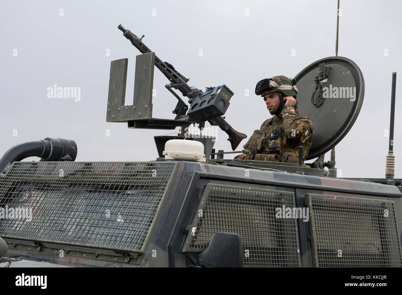 AN Italian Army Soldier puts on his Personal Protective Equipment for a ...