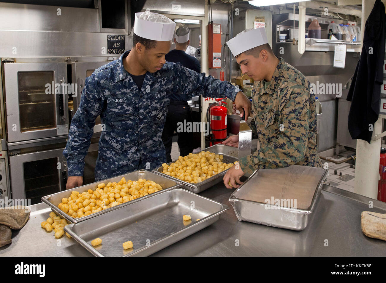 A U.S. Sailor and Pfc. Alejandro Coronado, food service specialist with ...