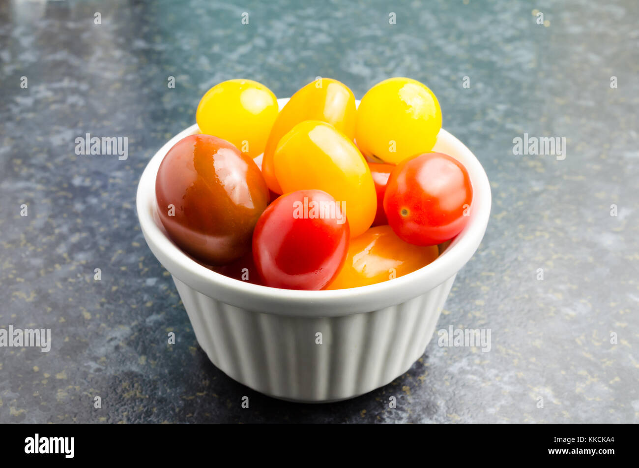Snack Tomatoes in a White Bowl Stock Photo - Alamy