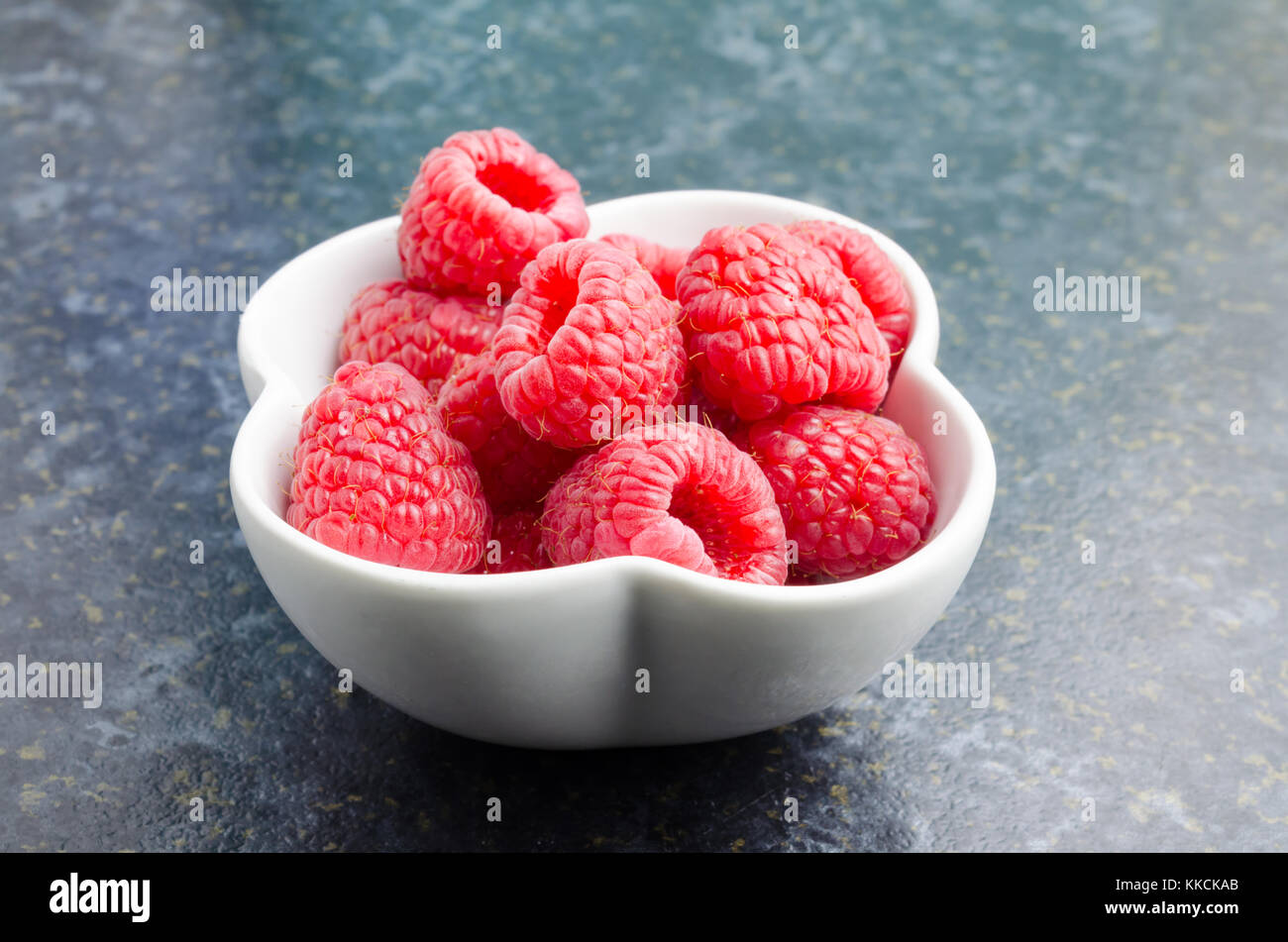Raspberries in a White Bowl Stock Photo - Alamy