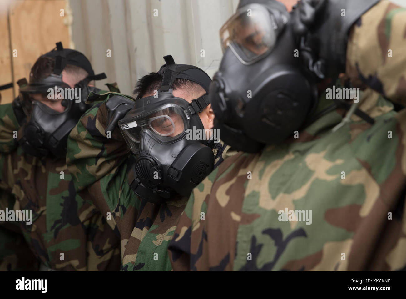 U.S. Marines with Marine Corps Embassy Security break the seal of their ...