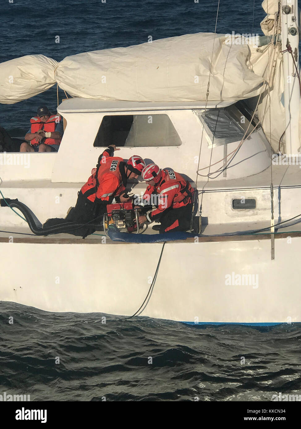 Coast Guard Petty Officer 2nd Class Joe Frissora and Fireman Mike ...