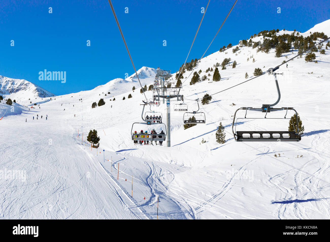 Chair alpine skiing lift. The line of the skiing lift leaves to top ...