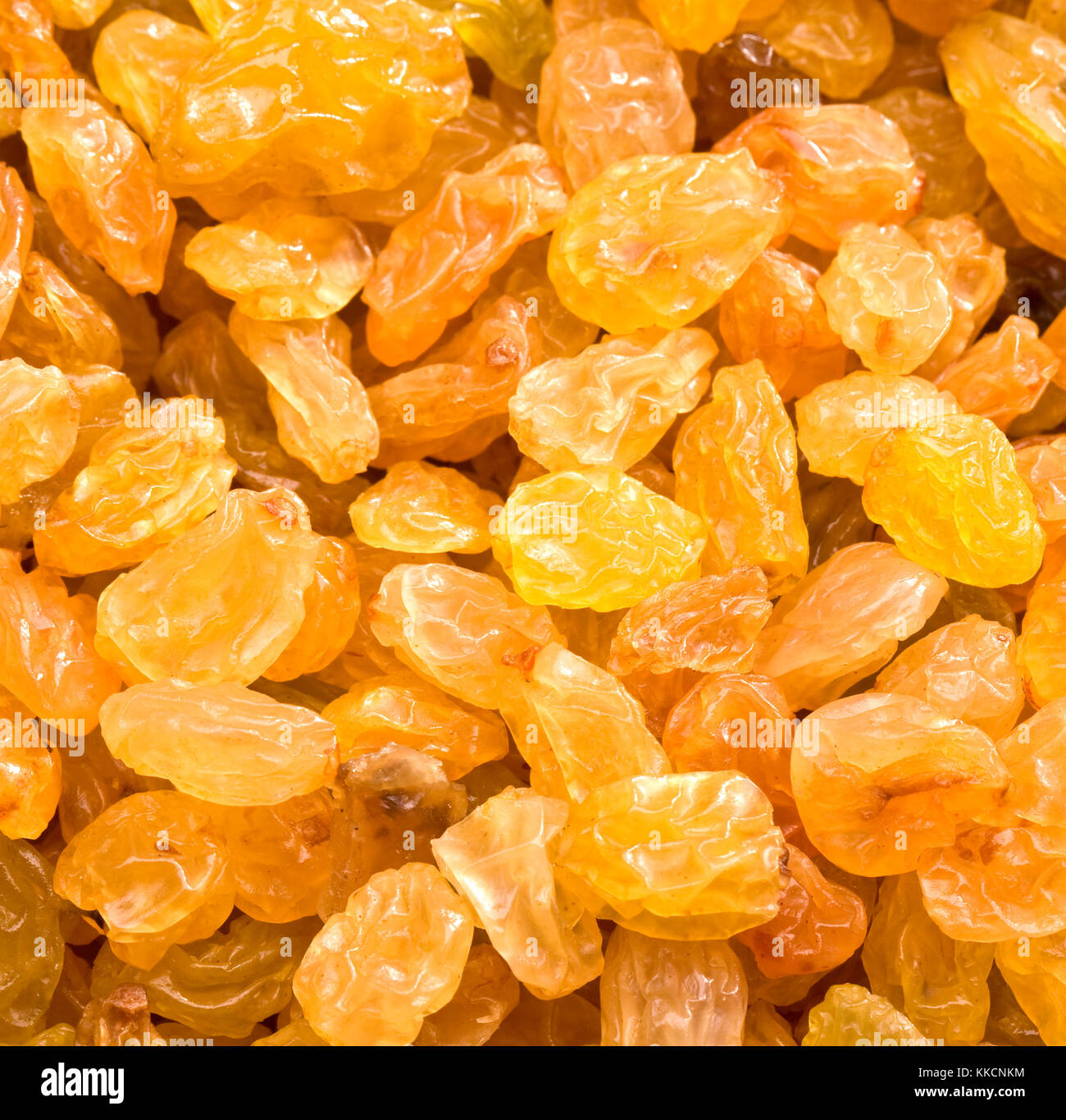Golden raisins close-up background Stock Photo - Alamy