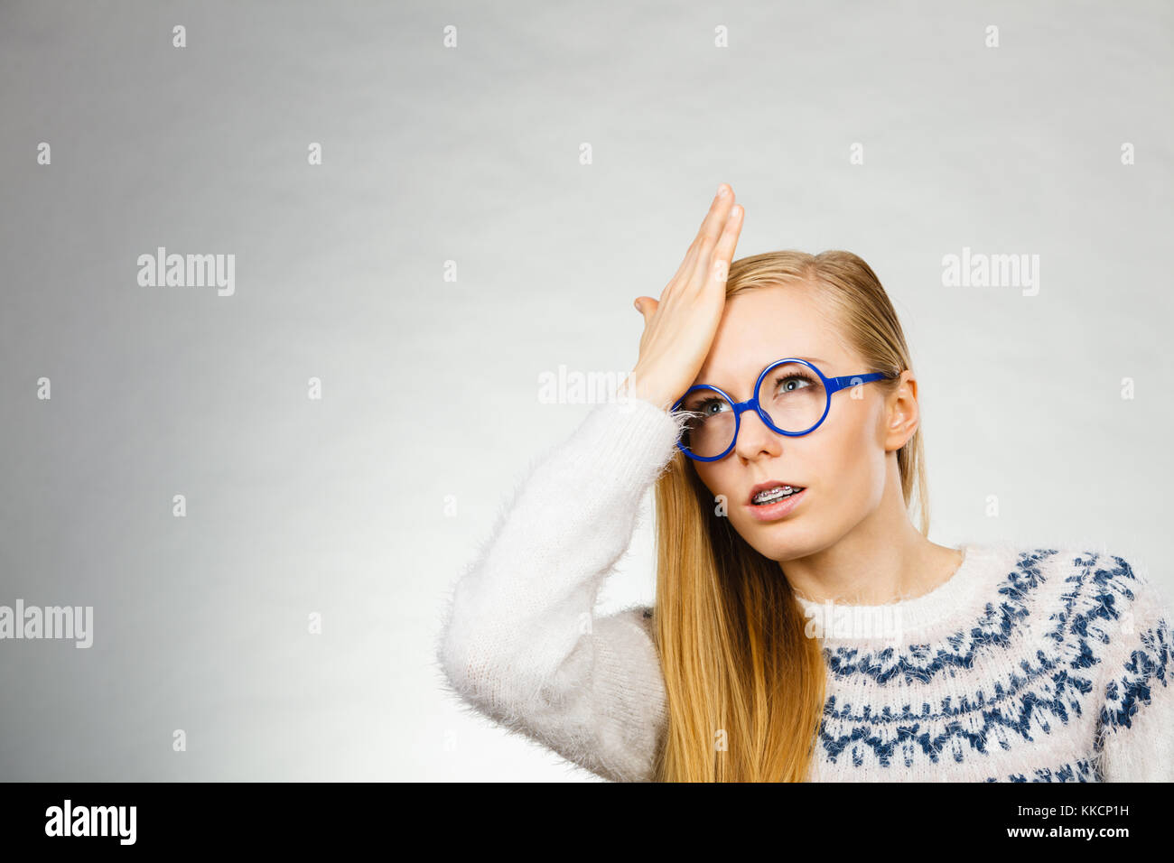 Face expressions, disregard, stupid behavior concept. Nerd blonde woman ...