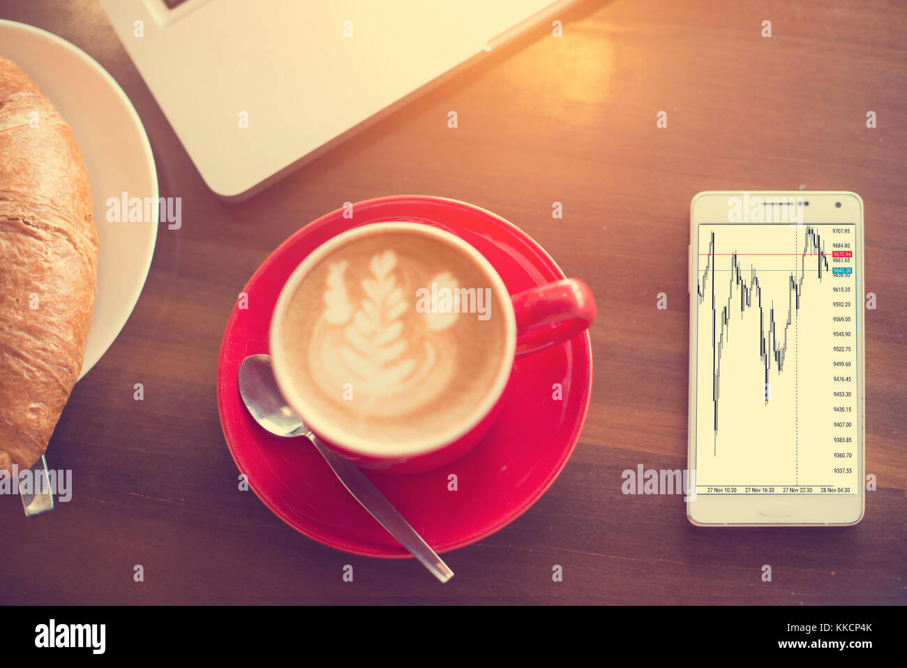 bitcoin price monitoring from cafe breakfast Stock Photo - Alamy