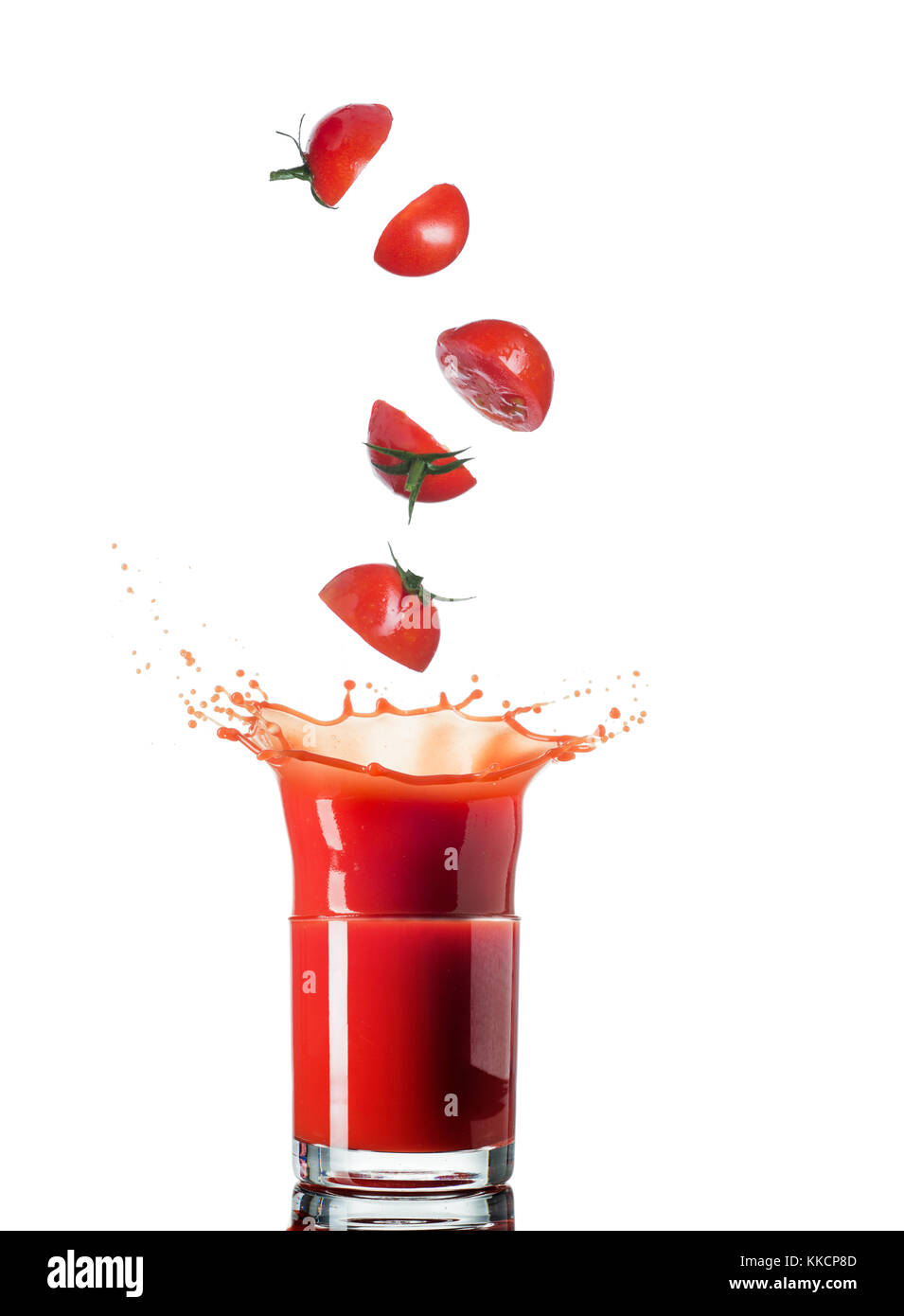 Tomato juice splash out from a glass isolated on white Stock Photo - Alamy