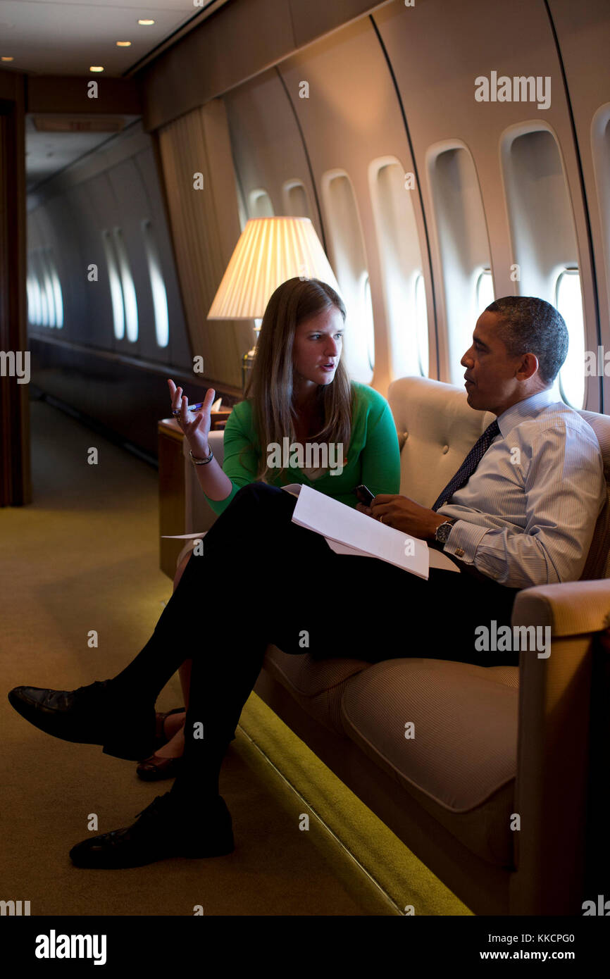 President Barack Obama talks with speechwriter Laura Dean aboard Air ...