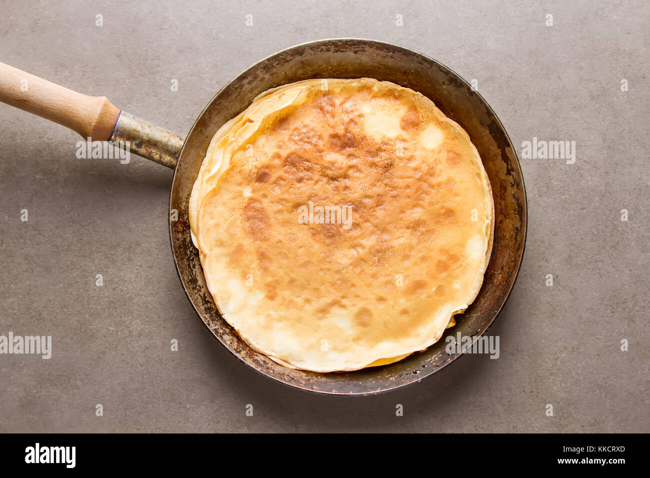 Stack of pancakes in a frying pan. Traditional for the Russian pancake ...