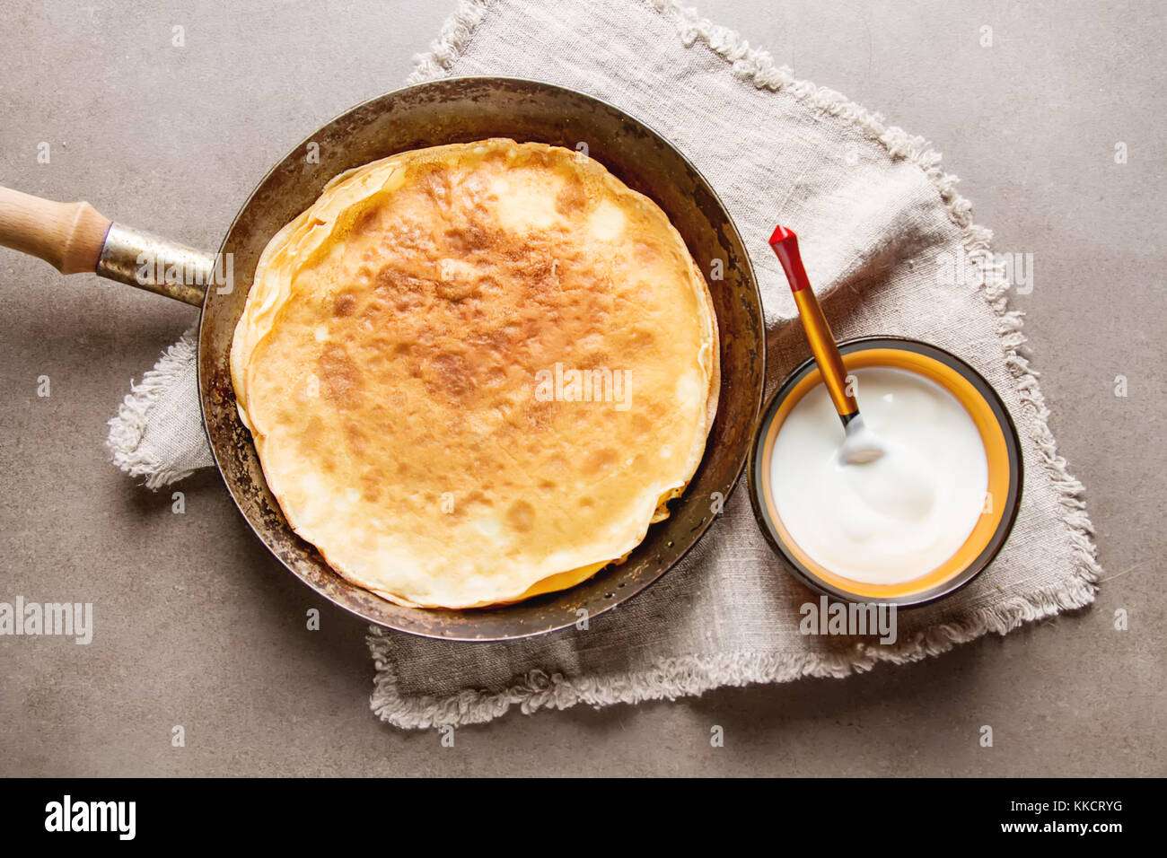 Stack of pancakes in a frying pan. Traditional for the Russian pancake ...