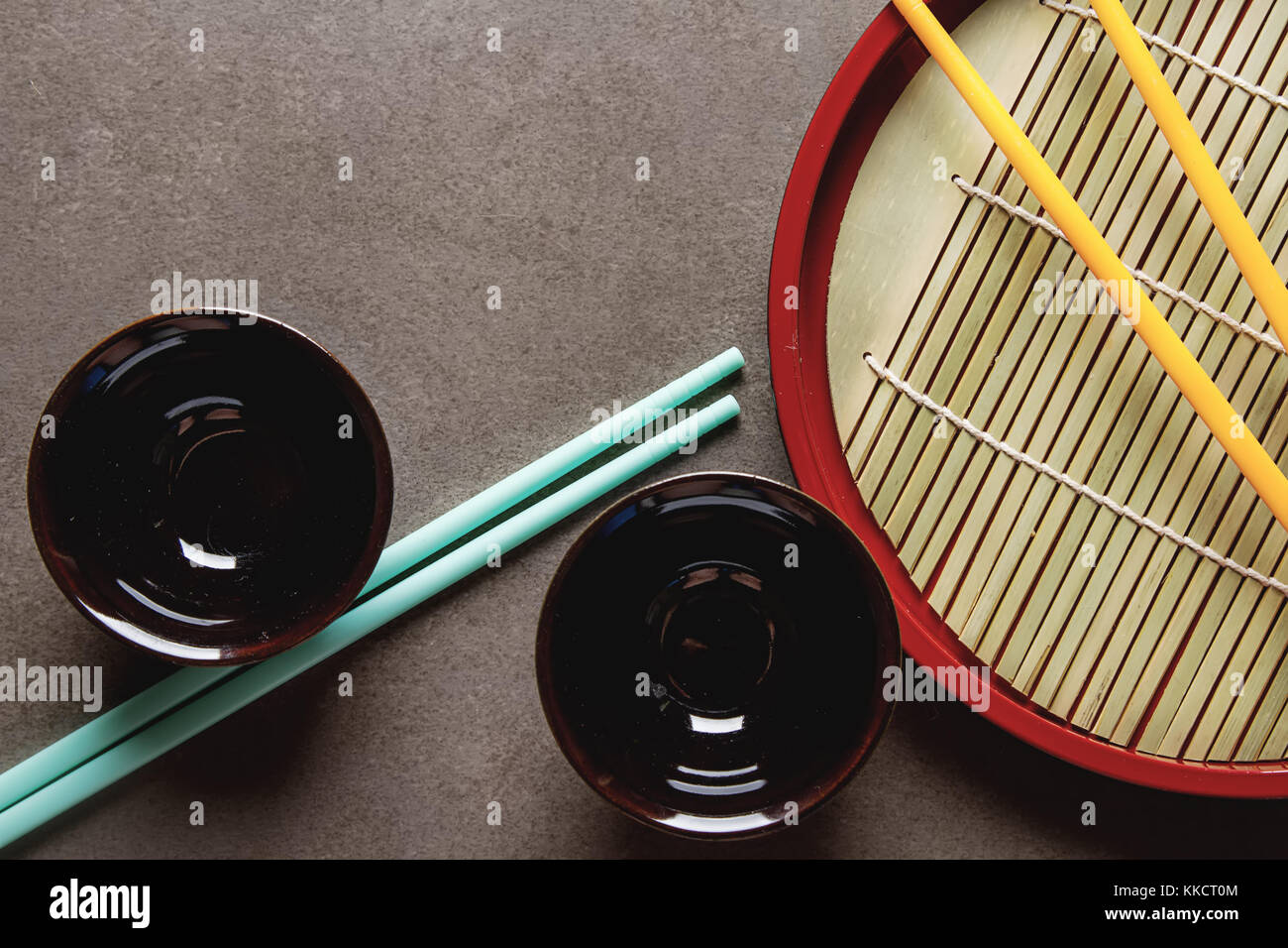 Chinese food. Two chopsticks for eating. Food sticks. Dark background ...