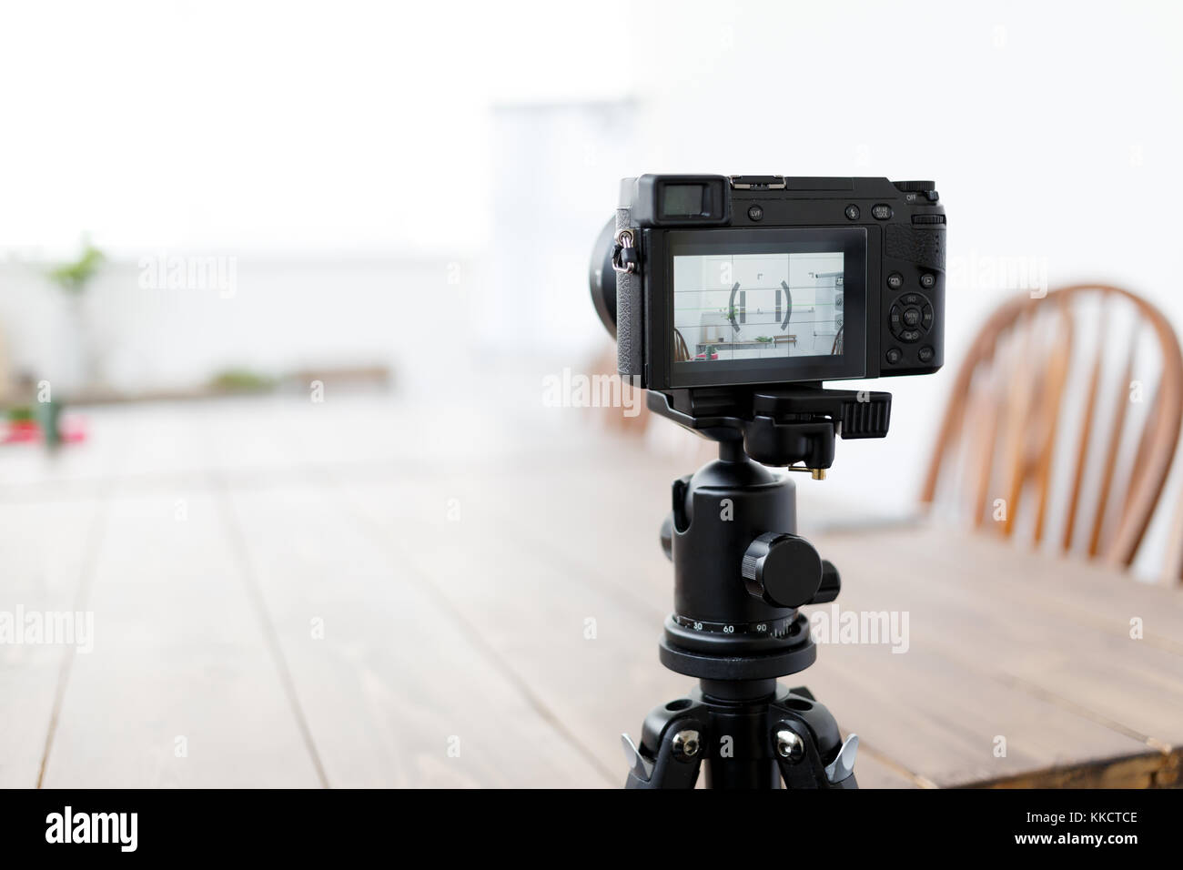 Image of camera in room with table Stock Photo - Alamy