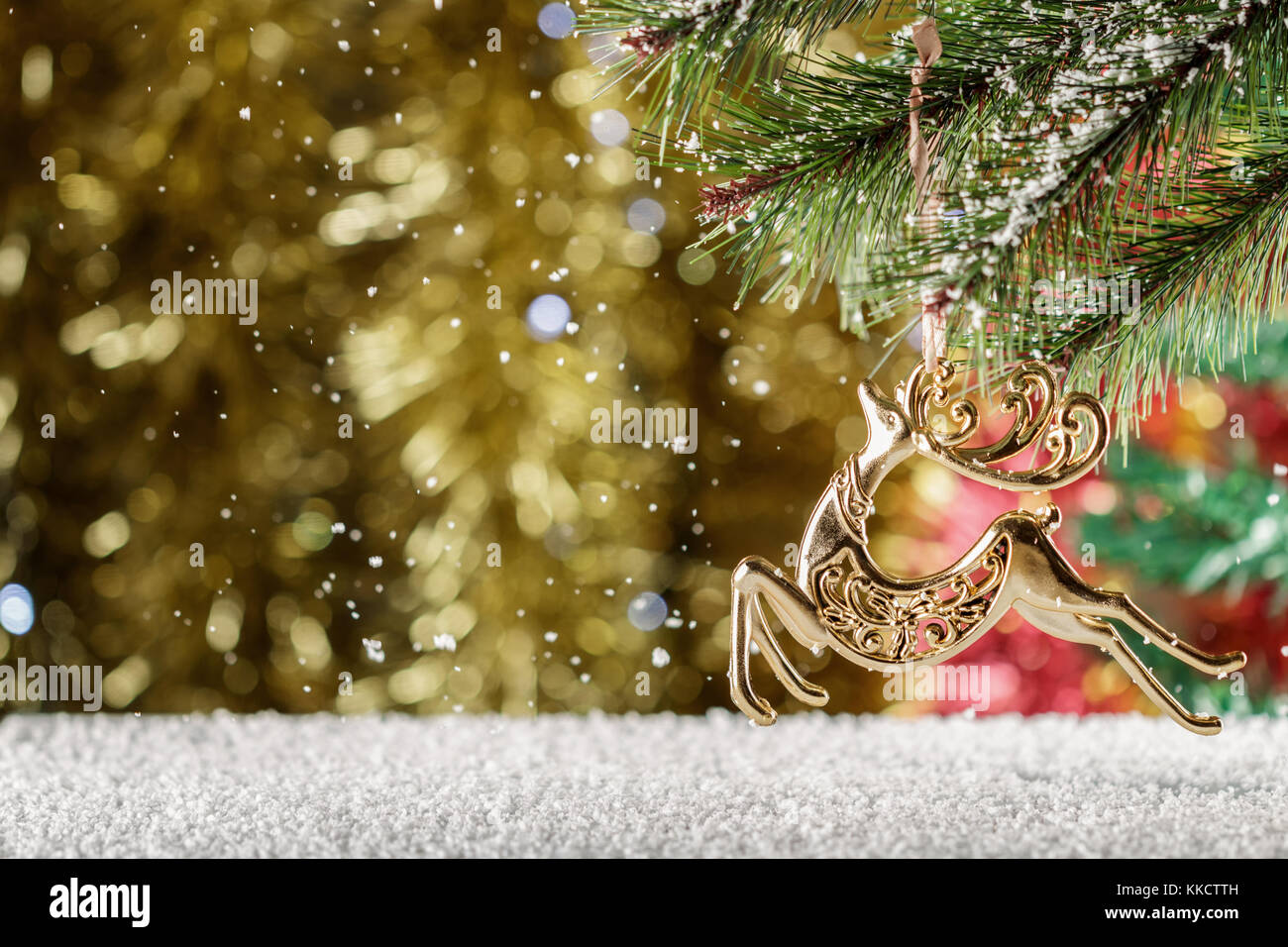Christmas Golden reindeer. Falling snow, winter scene. Place for text ...