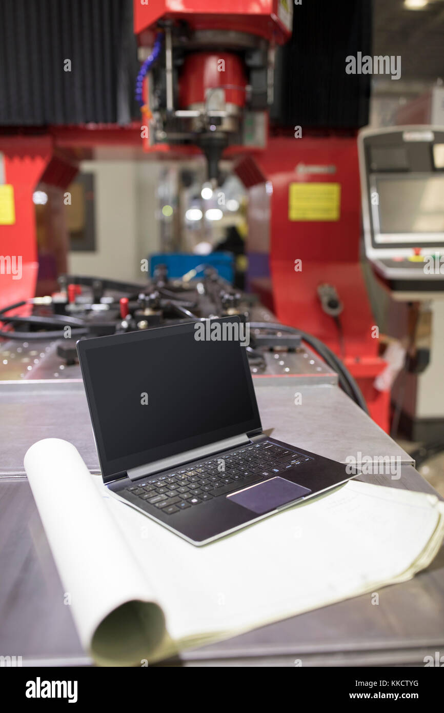 Blueprint and laptop Stock Photo - Alamy