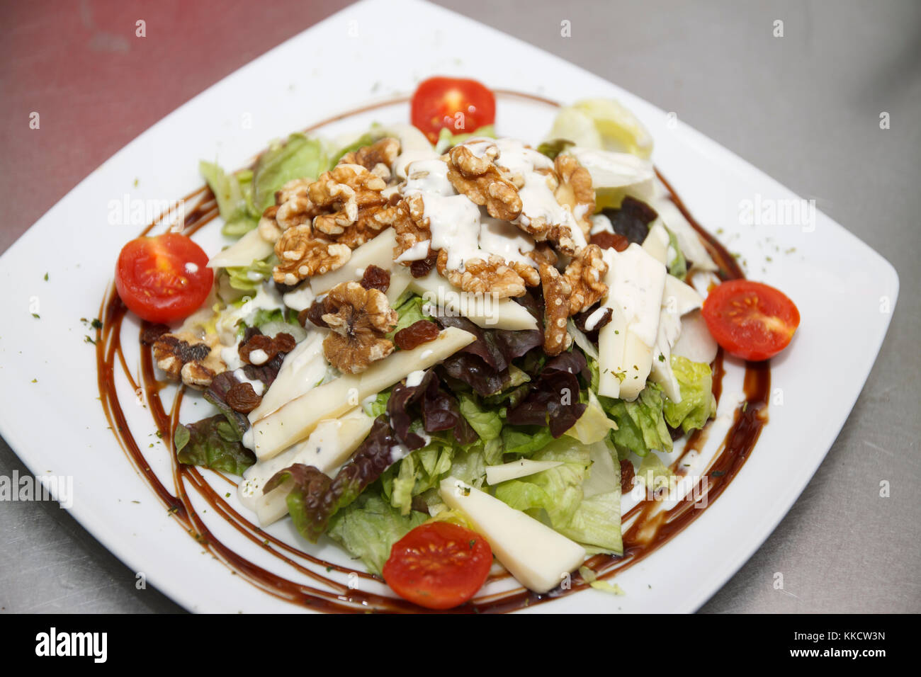 Elegant plate of salad decorated with balsamic vinegar Stock Photo - Alamy