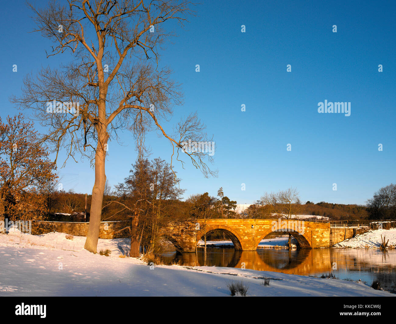 Rural Winter scene of a bridge over the River Derwent in North ...