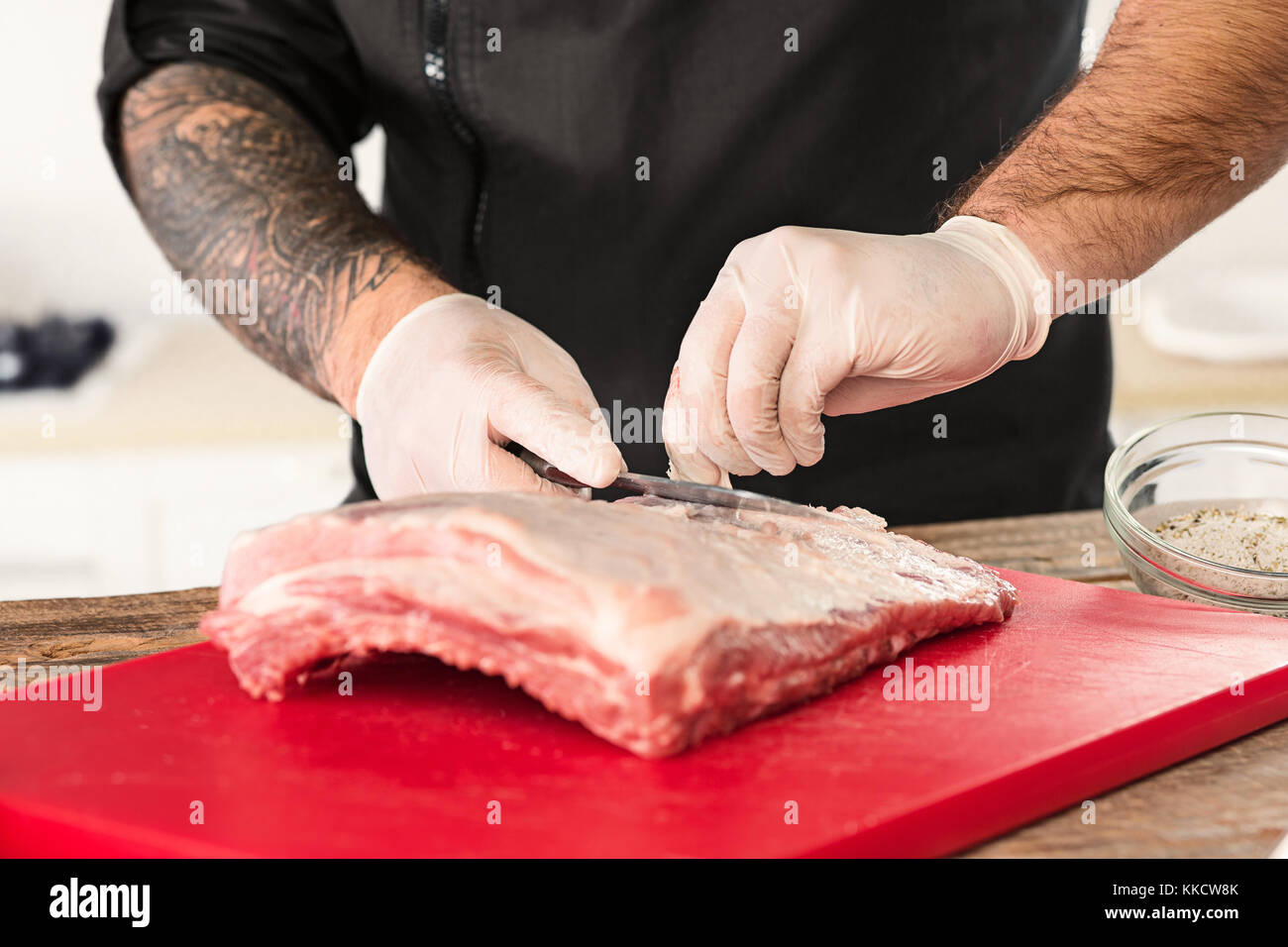 Man cooking meat steak on kitchen Stock Photo - Alamy