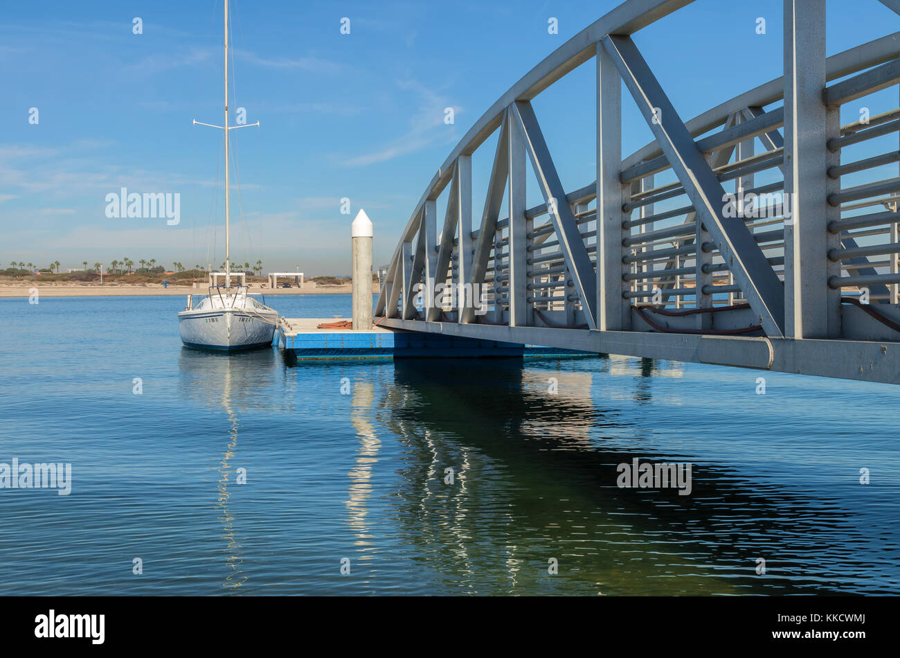 Small bridge connecting to a dock with docked boat, Coronado Bay ...