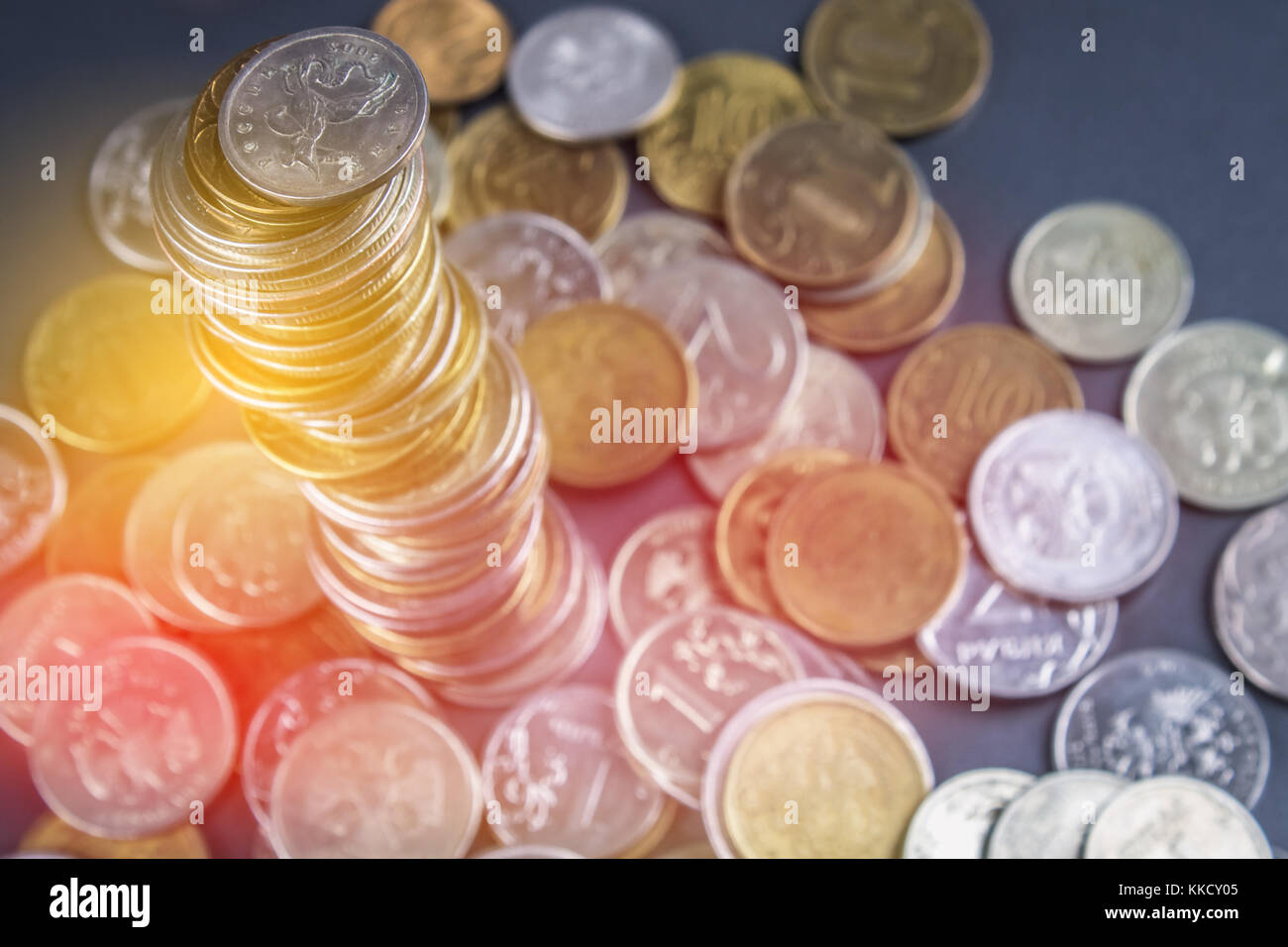 Stacks of Russian coins on a gray background with droplets of water ...