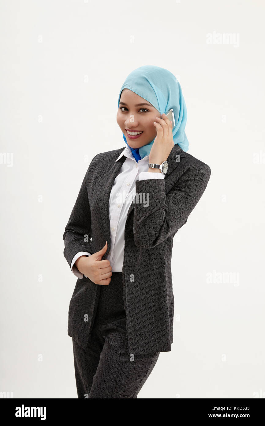 malay business woman talking using mobile phone Stock Photo - Alamy