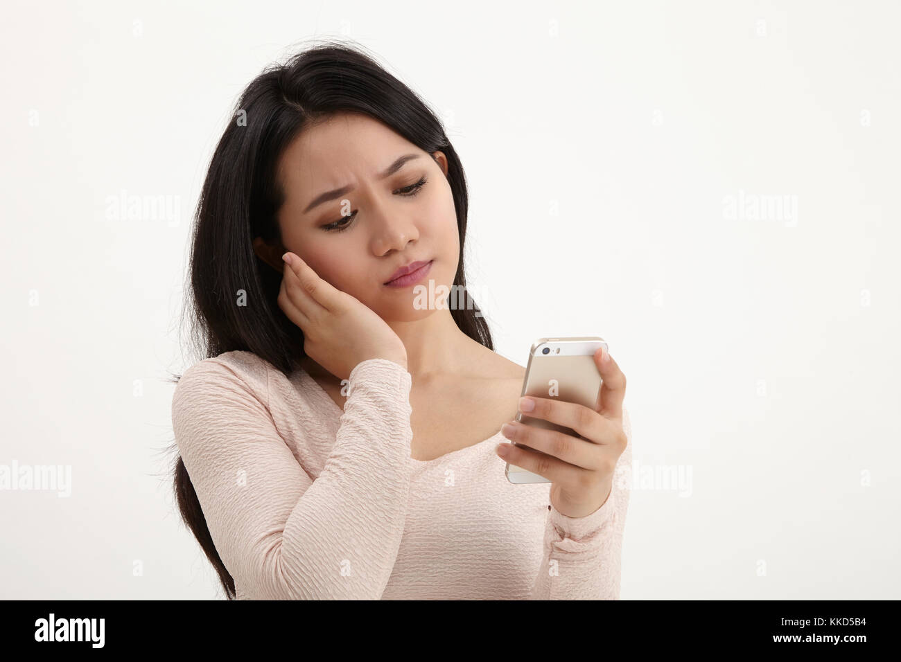 woman feeling sad watching smart phone Stock Photo - Alamy