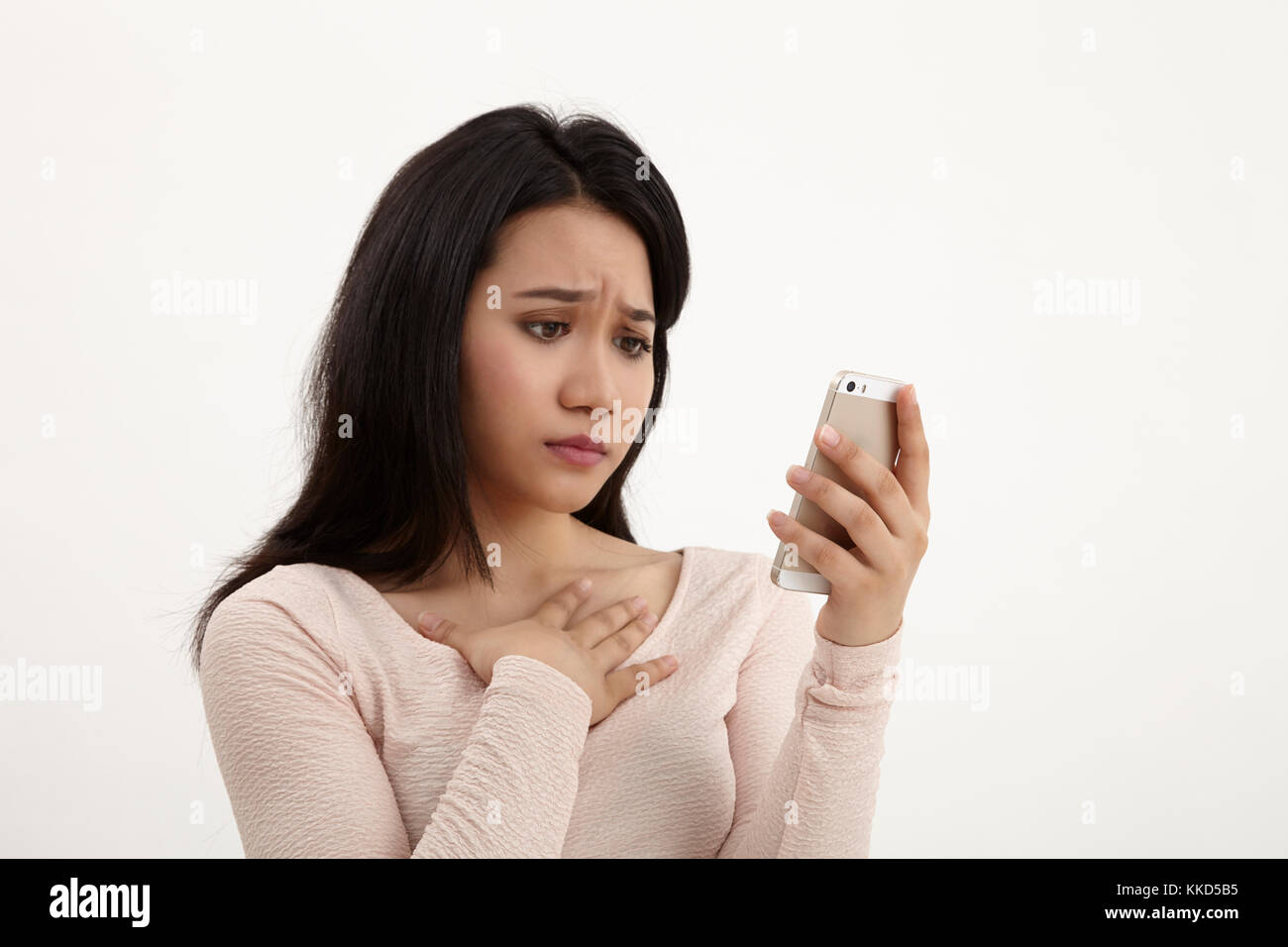 woman feeling sad watching smart phone Stock Photo - Alamy