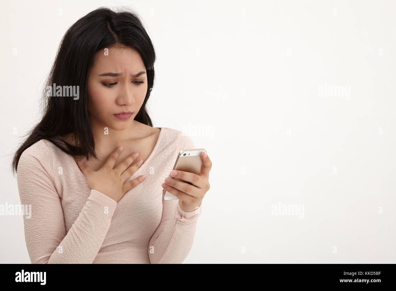 woman feeling sad watching smart phone Stock Photo - Alamy