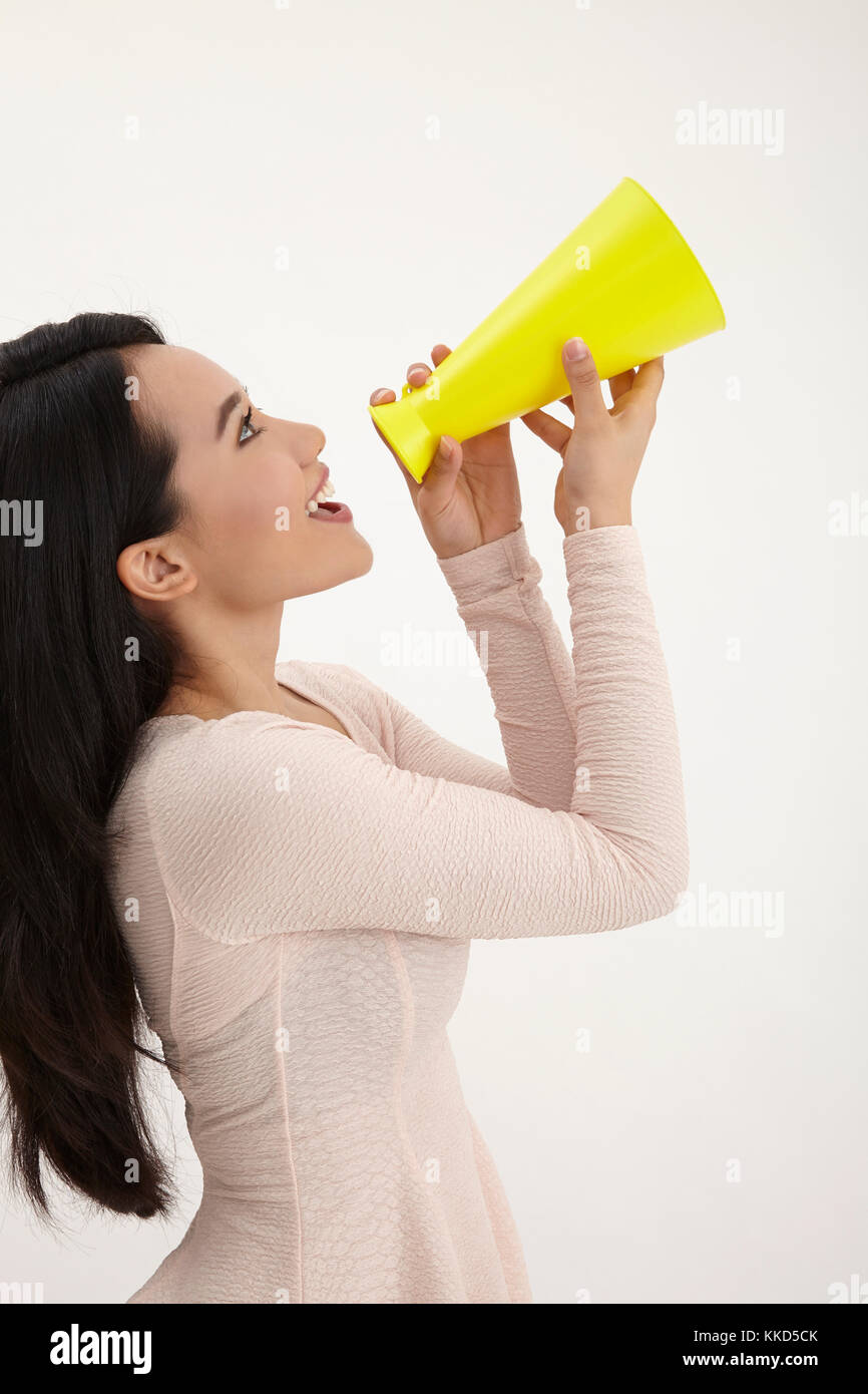 malay woman using megaphone on the white background Stock Photo - Alamy