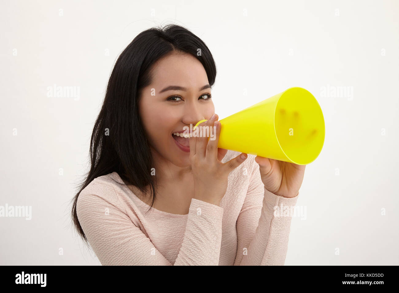 malay woman using megaphone on the white background Stock Photo - Alamy