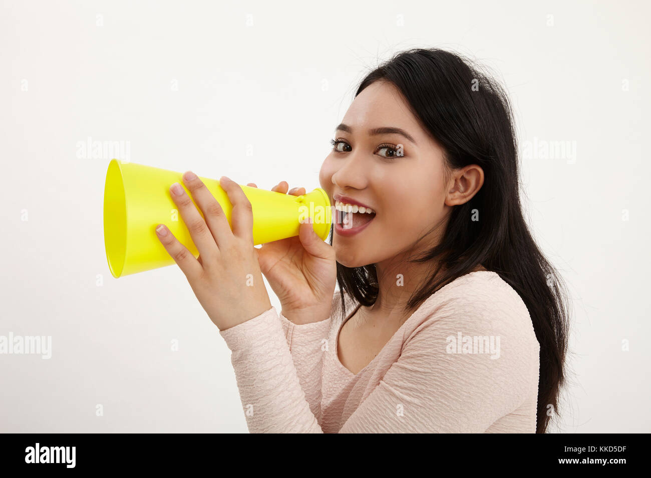 malay woman using megaphone on the white background Stock Photo - Alamy