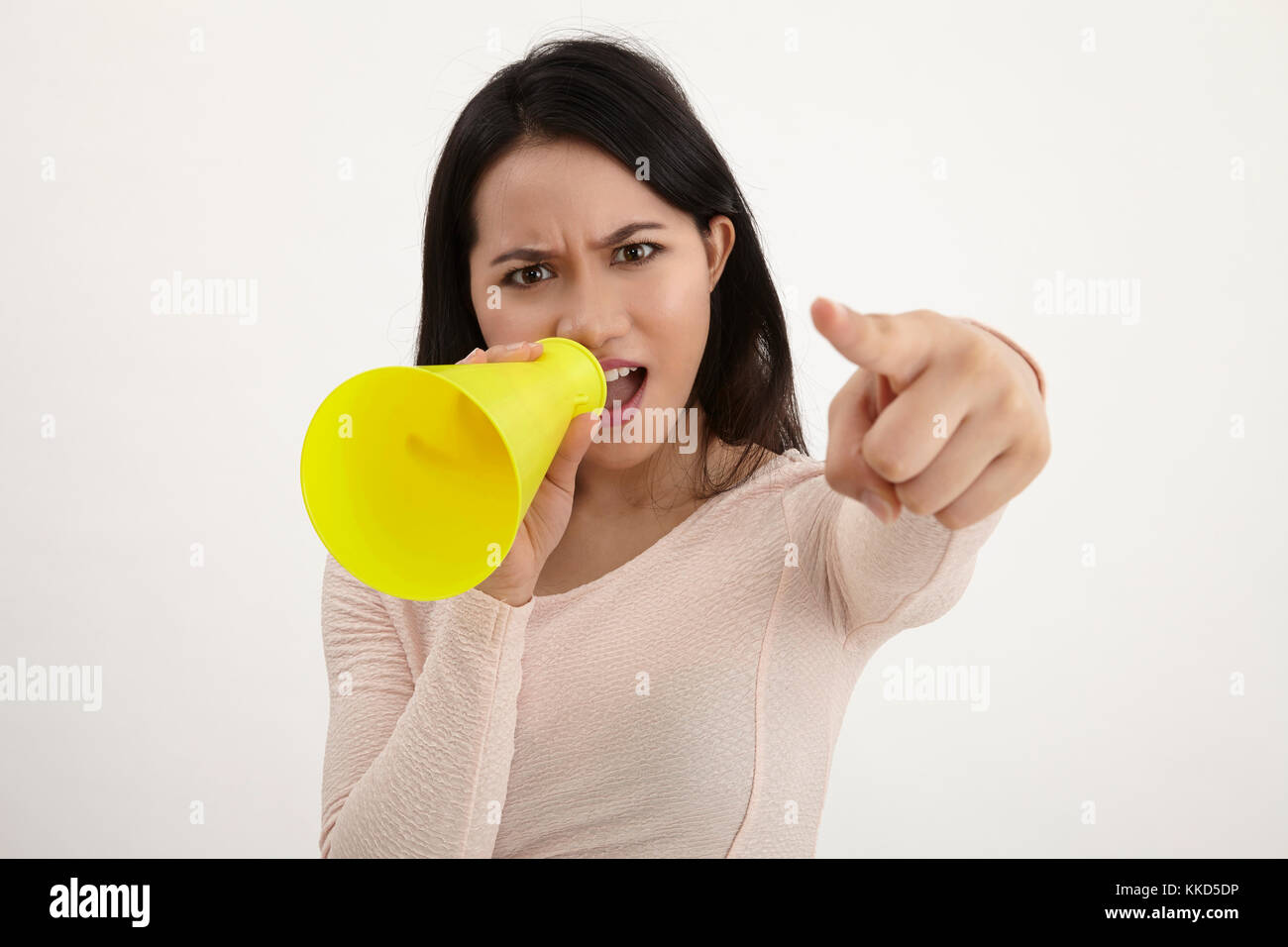 malay woman using megaphone on the white background Stock Photo - Alamy