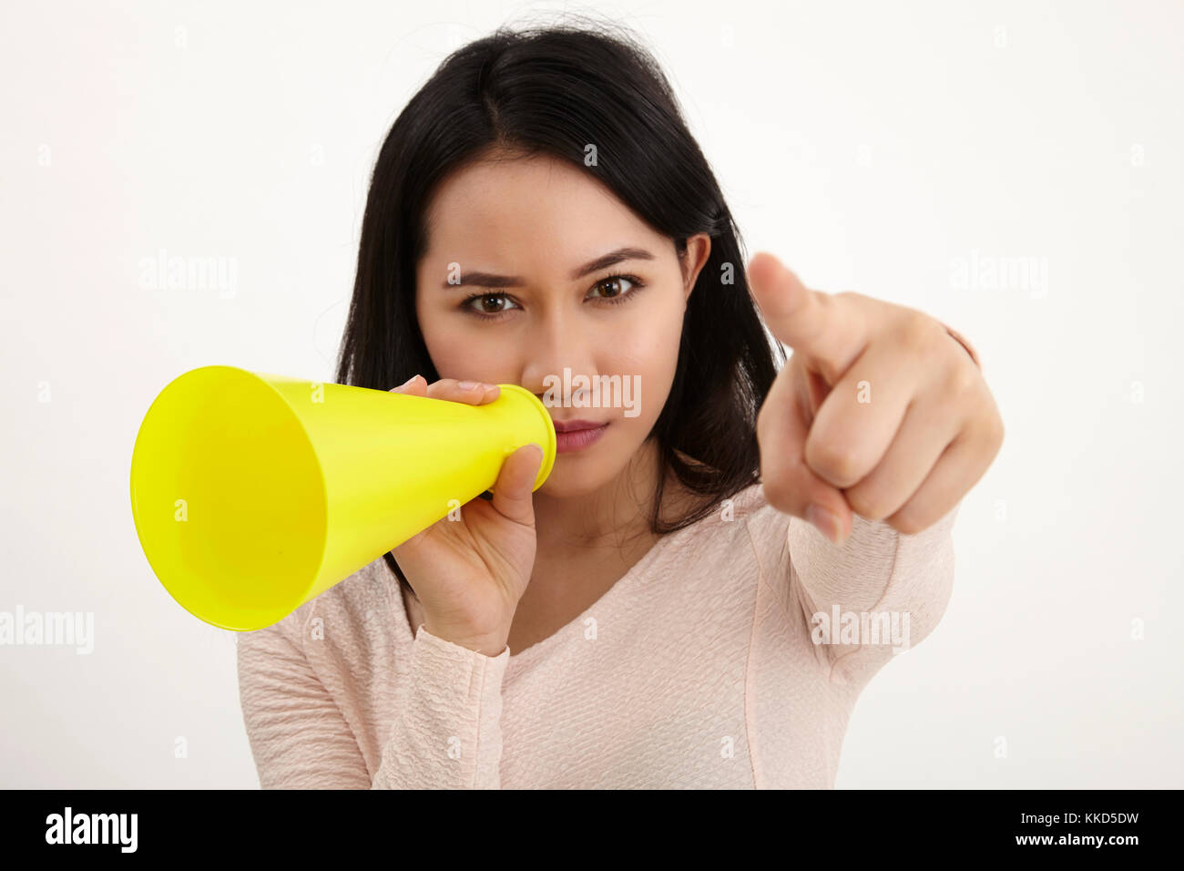 malay woman using megaphone on the white background Stock Photo - Alamy